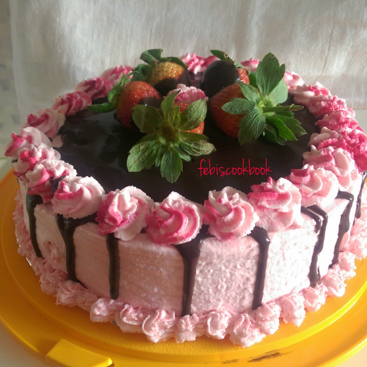 Vanilla and Pista Sponge Cake with Whipped Cream and White Chocolate Glaze